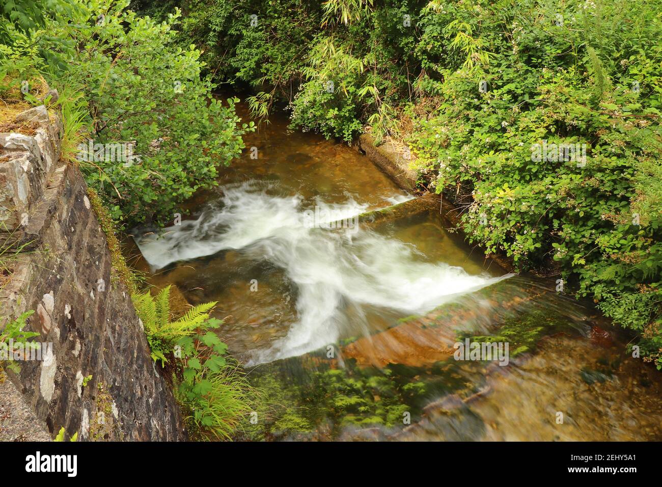 Heddon river flowing through the valley and over rocky ground Stock ...