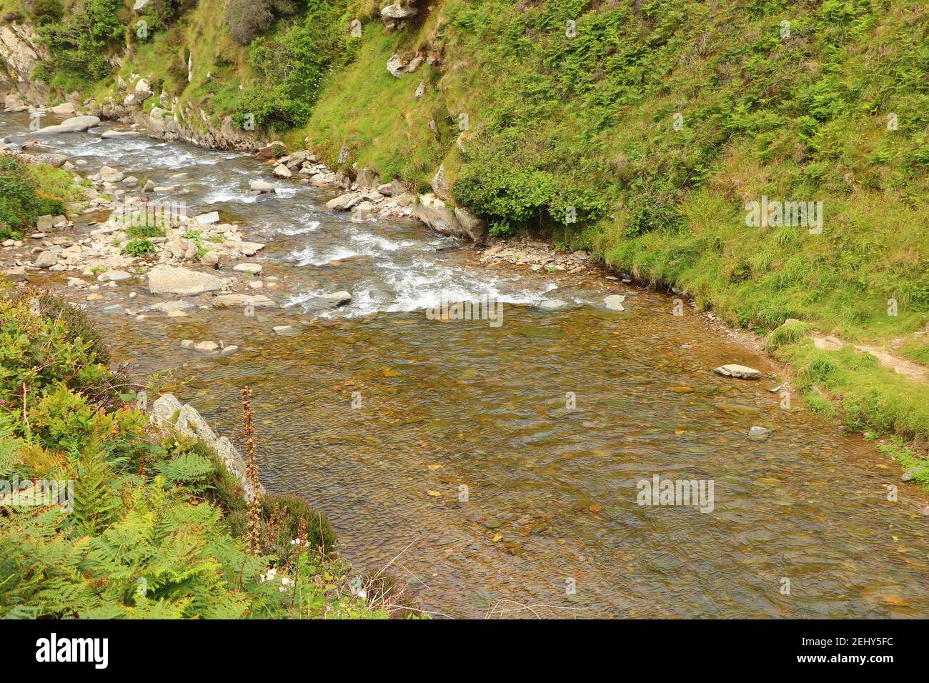 Heddon river flowing through the valley and over rocky ground Stock ...