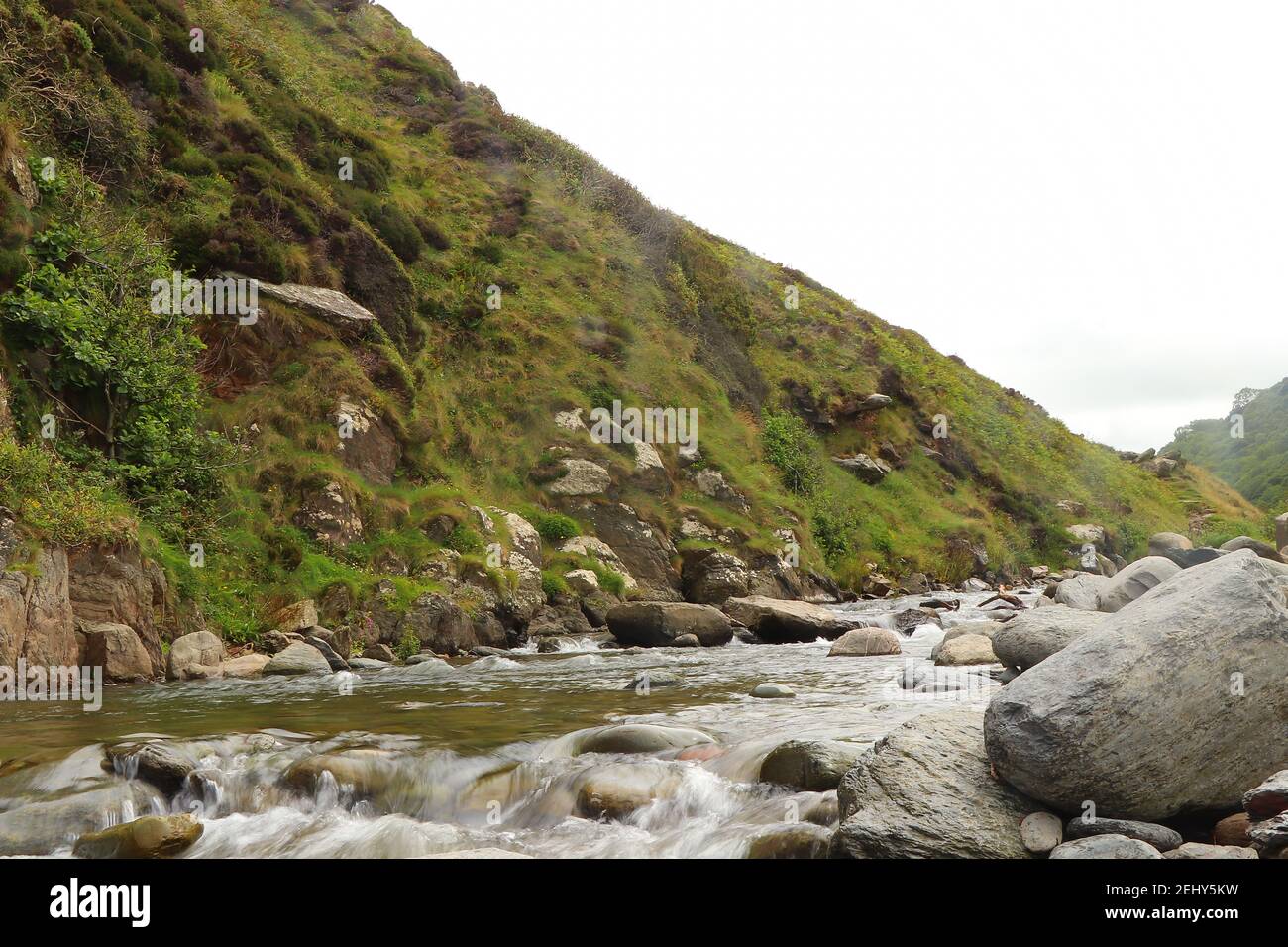 Heddon river flowing through the valley and over rocky ground Stock ...