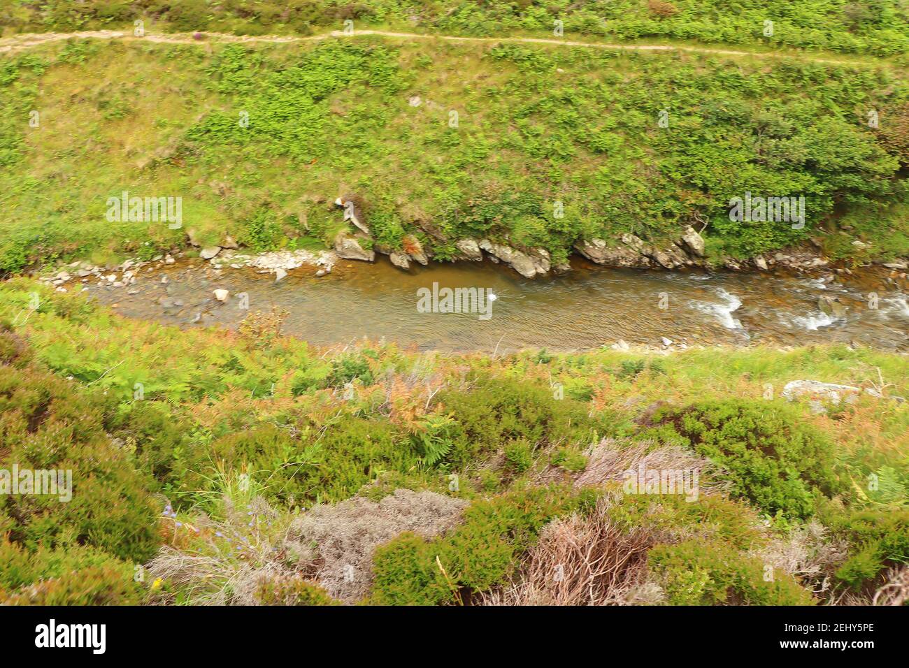 Heddon river flowing through the valley and over rocky ground Stock ...