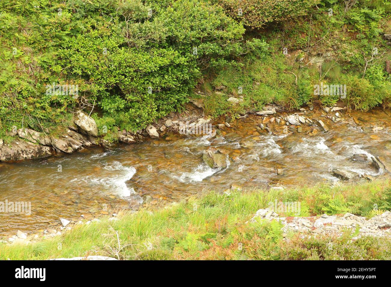 Heddon river flowing through the valley and over rocky ground Stock ...
