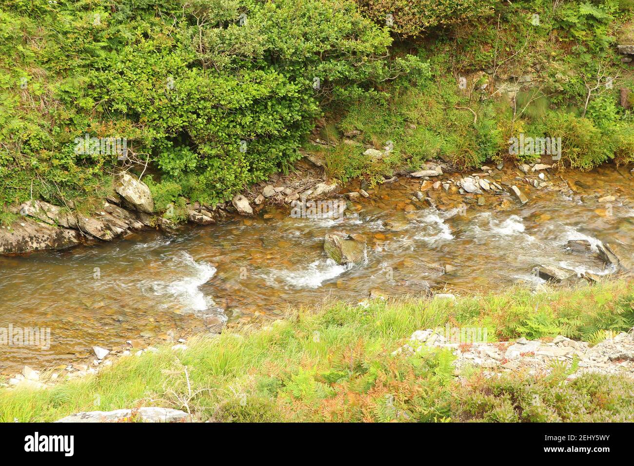 Heddon river flowing through the valley and over rocky ground Stock ...