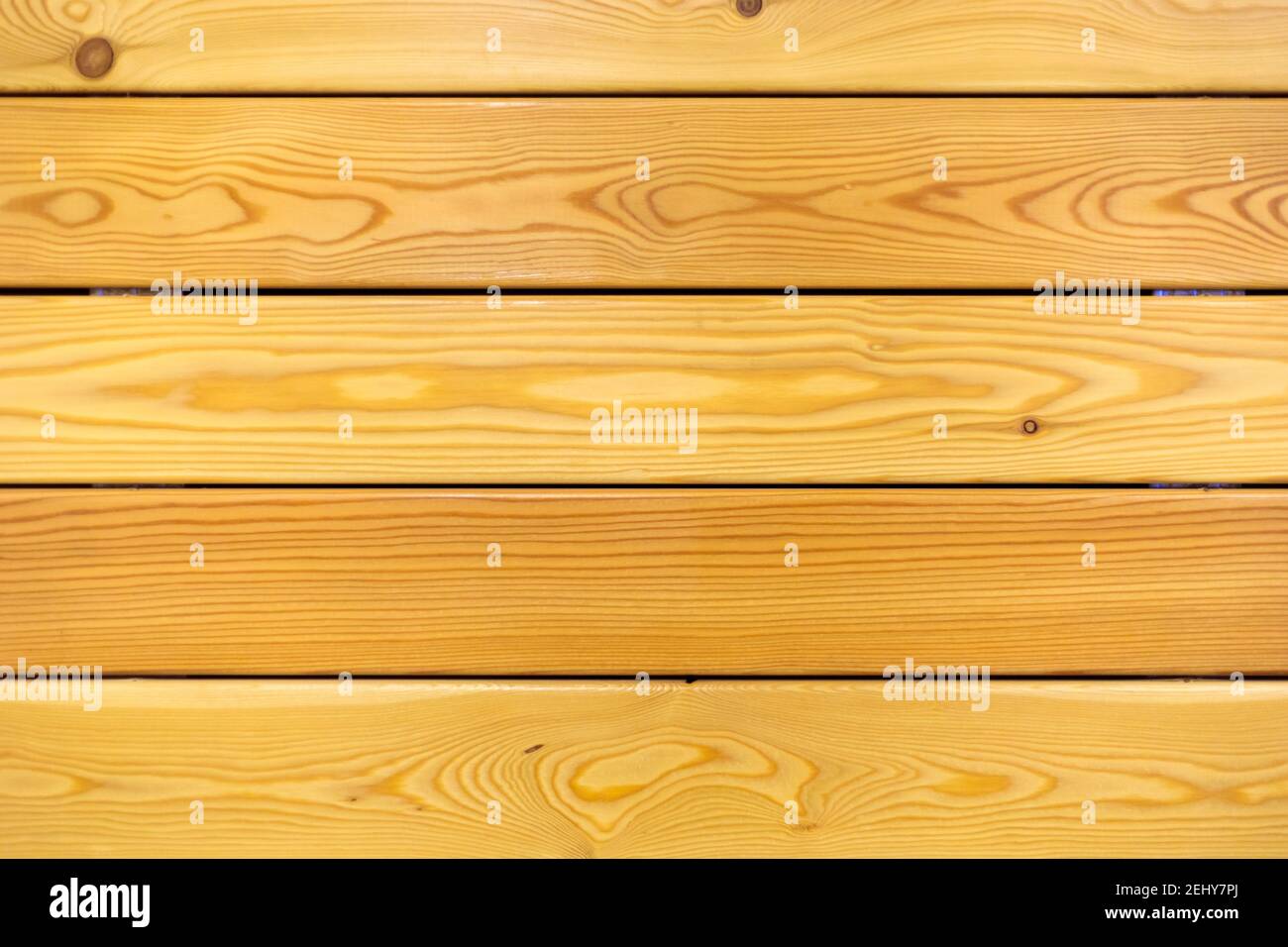 The light pine wall is horizontal. Light yellow texture with grooves ...