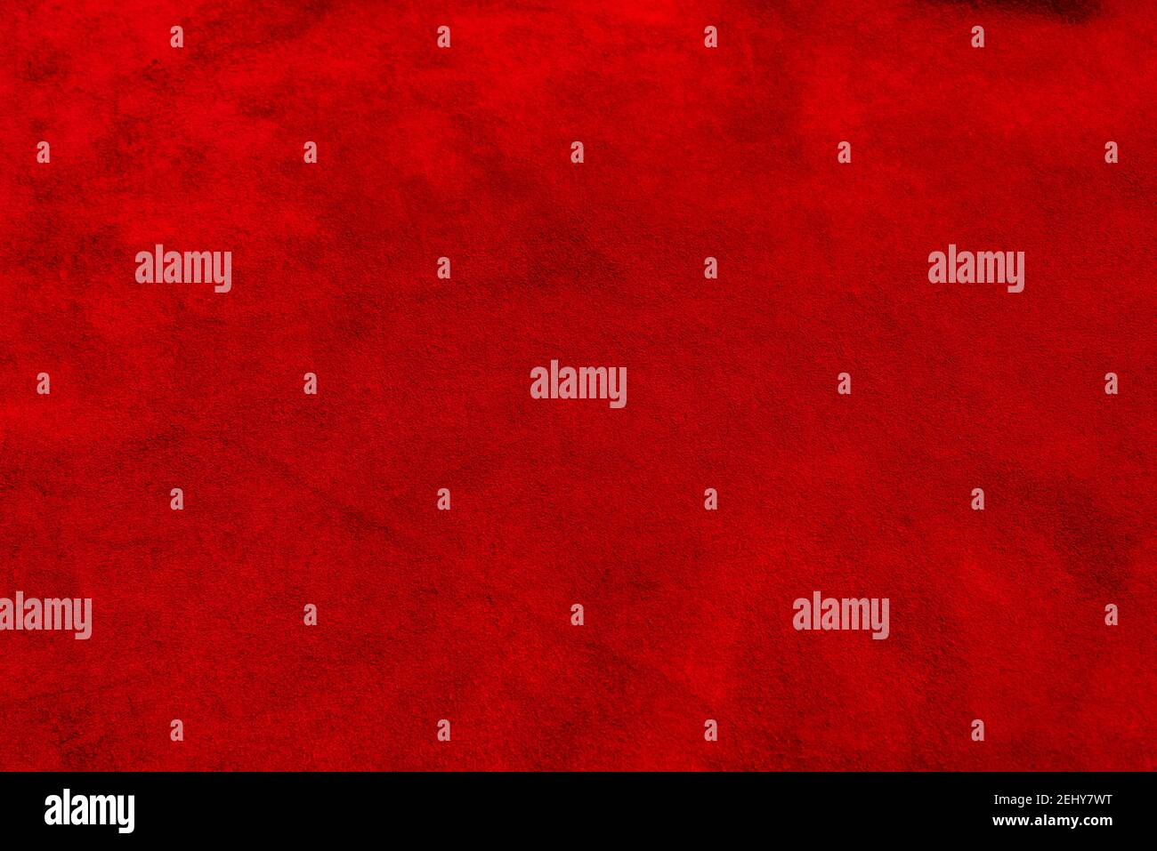 Red matte background of suede fabric, closeup. Velvet texture of ...