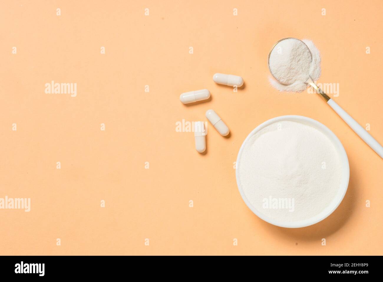 Collagen powder dietary supplement at blue Stock Photo - Alamy