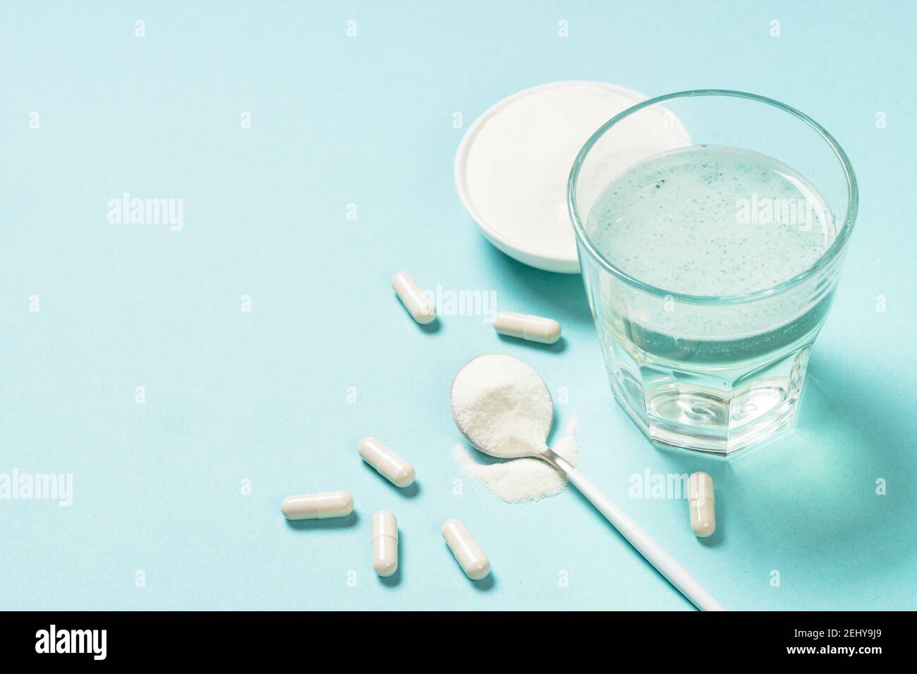 Collagen powder drink, dietary supplement at blue Stock Photo - Alamy
