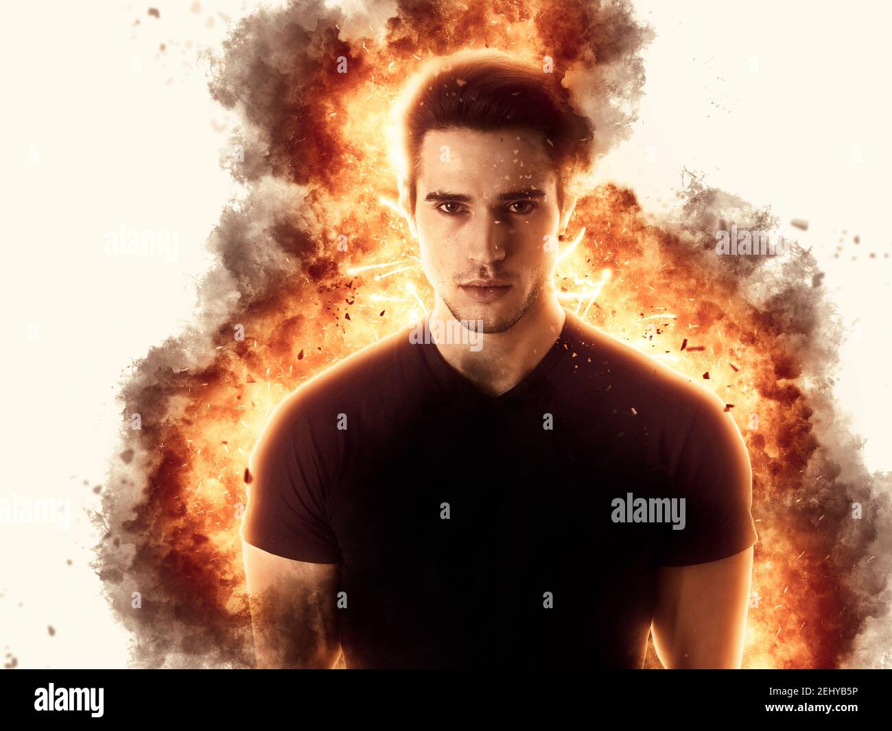Young man with fire explosion or flame burst behind him Stock Photo - Alamy
