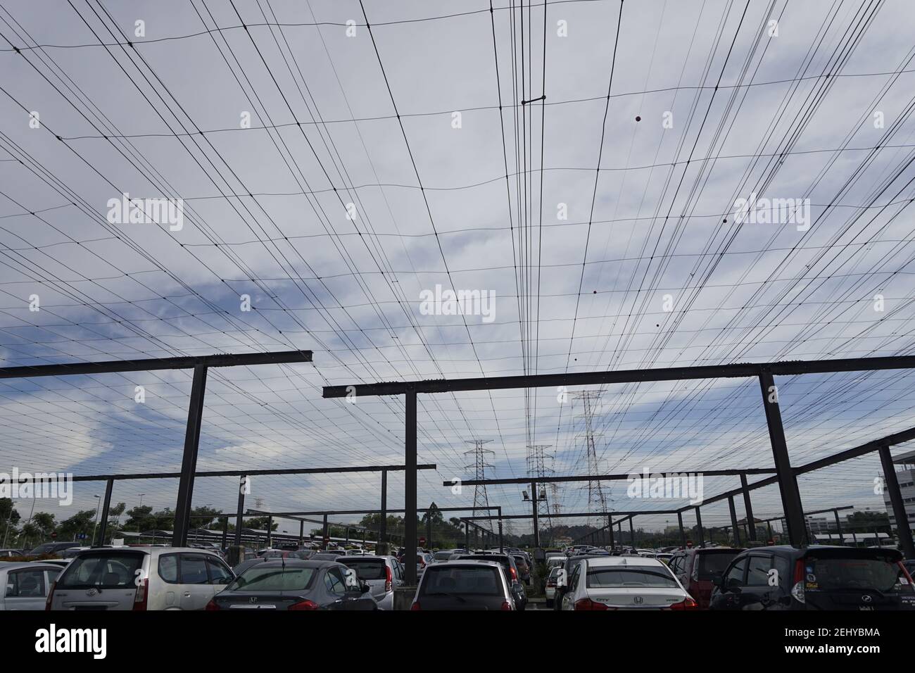 car parking lot under power transmission lines Stock Photo - Alamy