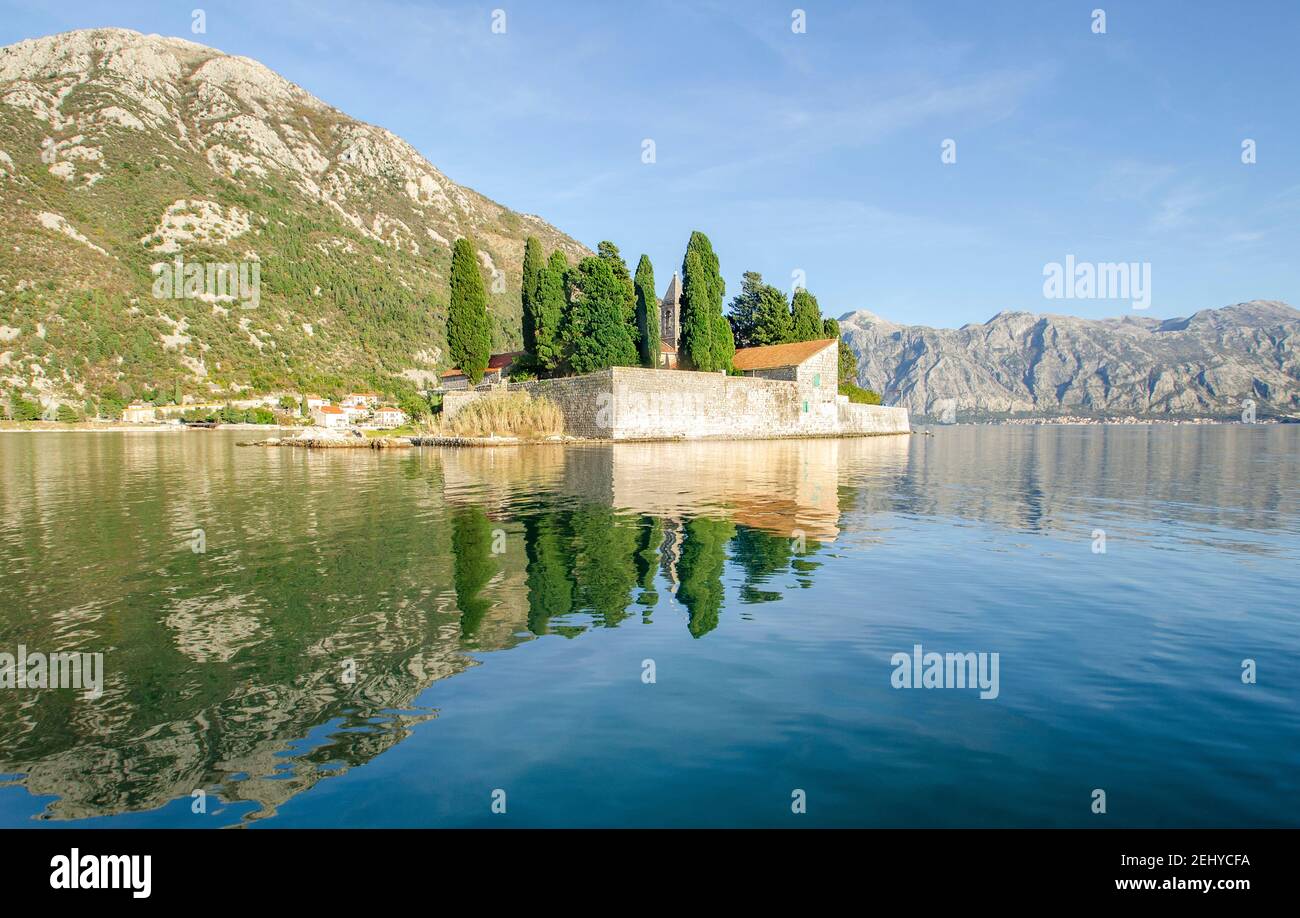 Church 'Our Lady of the Rock' with Perast town in the background, Kotor ...
