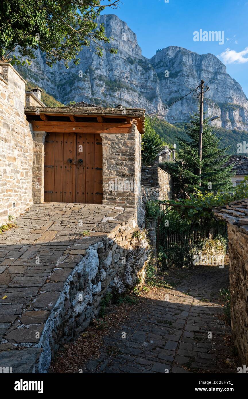 Traditional architecture and cobble-stone narrow street in Mikro Papigo ...
