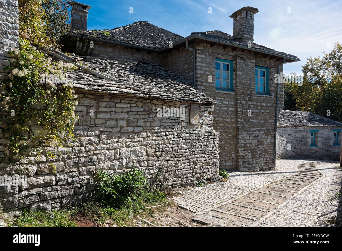 Stone houses of traditional architecture and cobble-stone narrow street ...