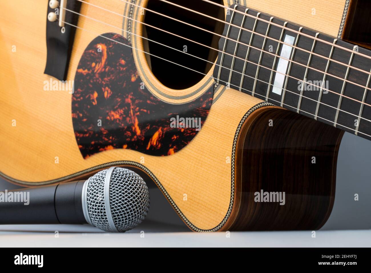 Acoustic guitar body with microphone on white background Stock Photo ...