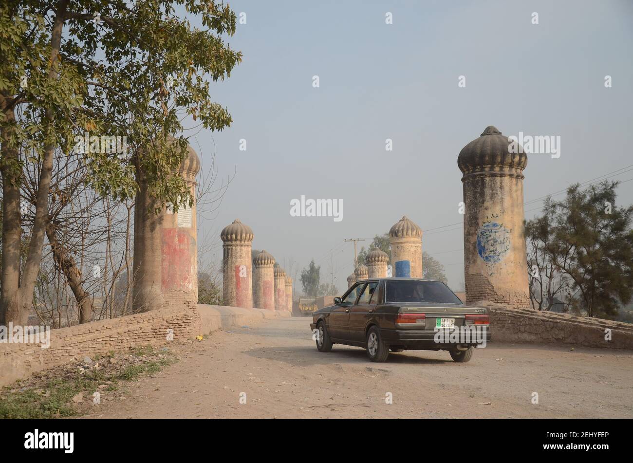 People crosses the Bara Bridge. The historic Chuha Gujar also known as Bara Bridge located in ...