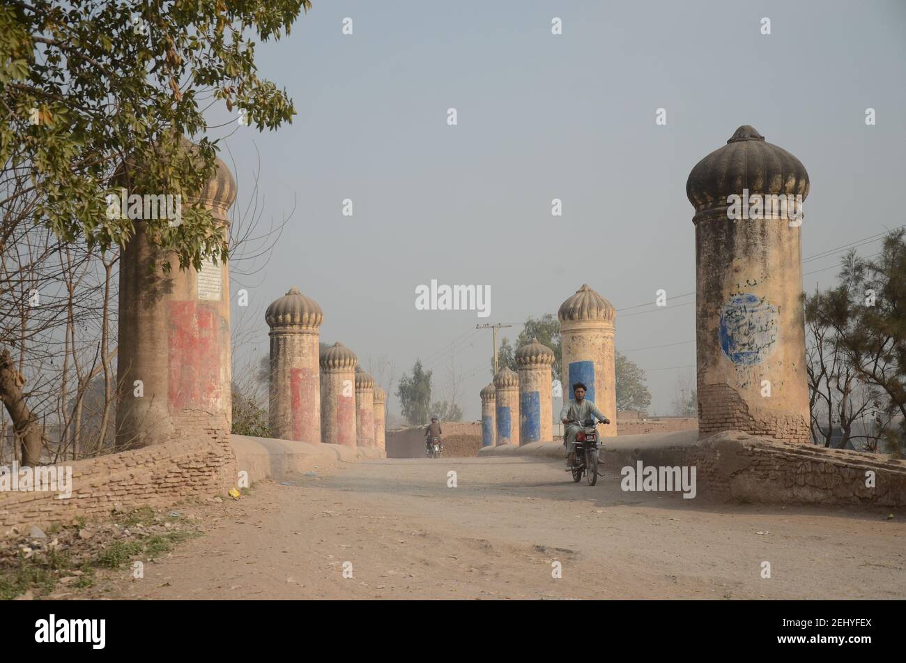 People crosses the Bara Bridge. The historic Chuha Gujar also known as Bara Bridge located in ...
