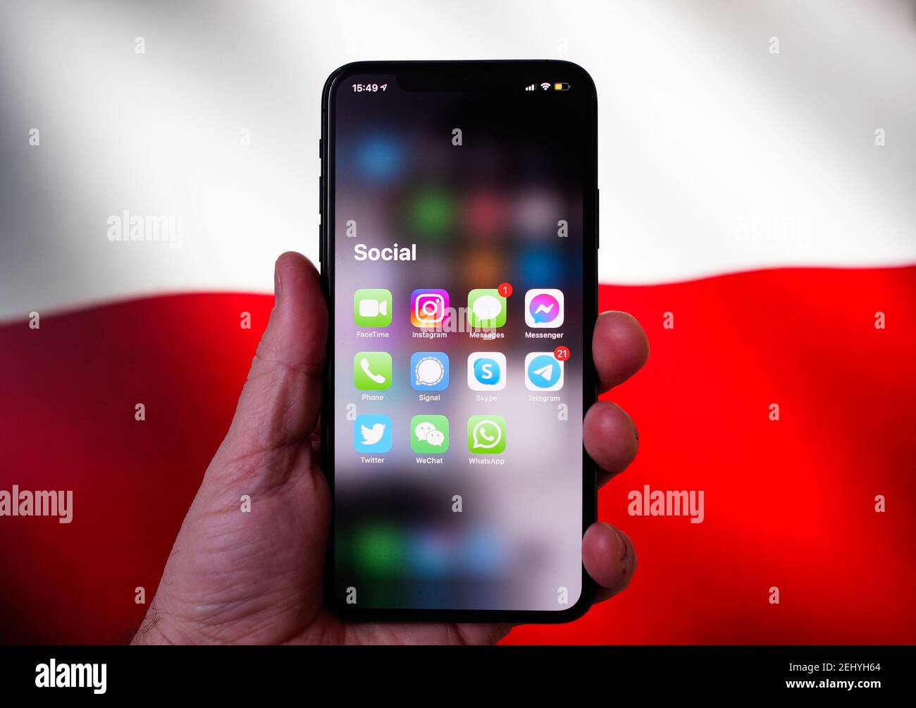 Social media applications are seen on an iphone with the Polish flag in ...