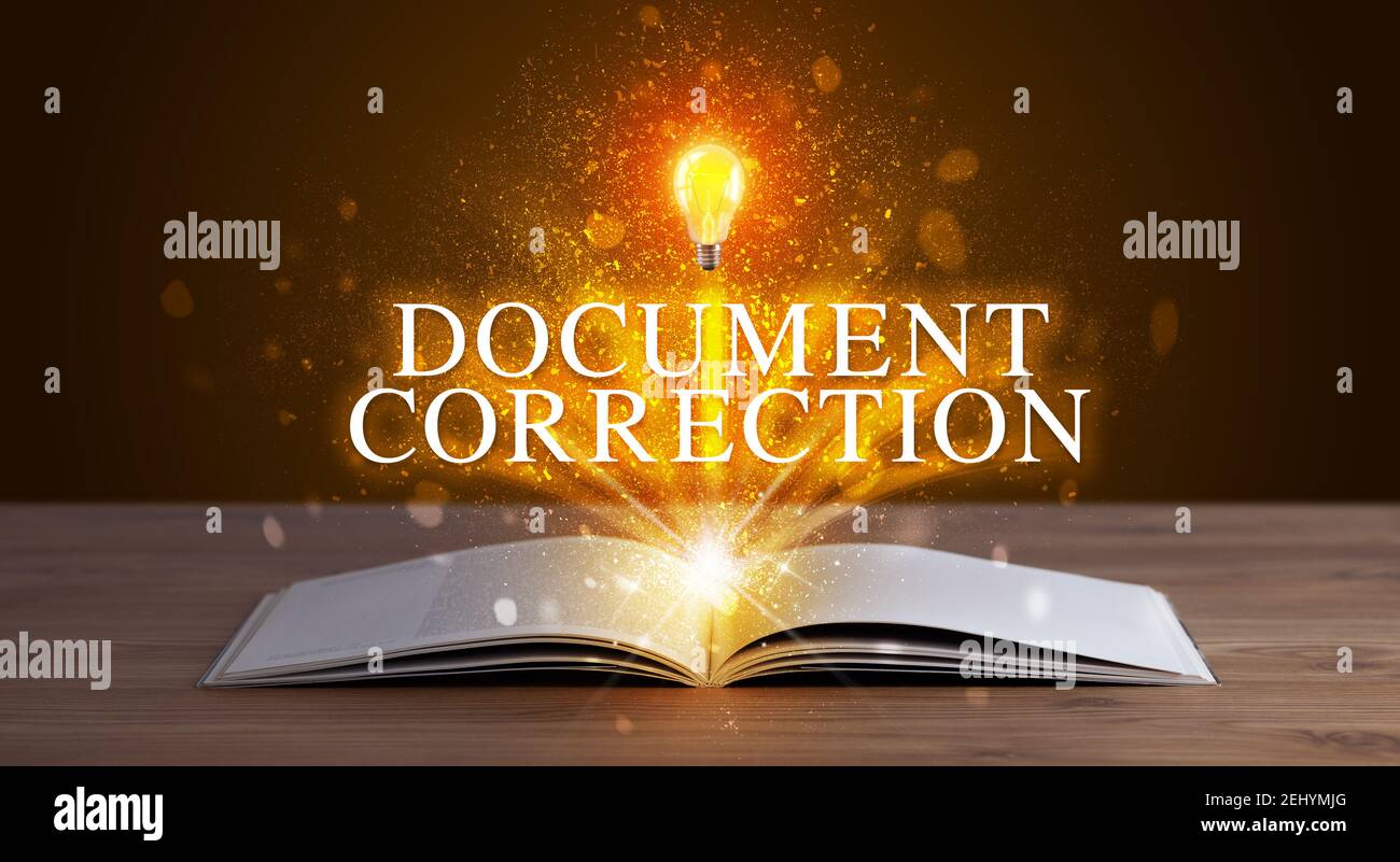 DOCUMENT CORRECTION inscription coming out from an open book ...