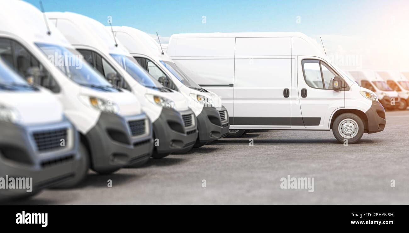 Delivery vans in a row with space for logo or text. Express delivery ...