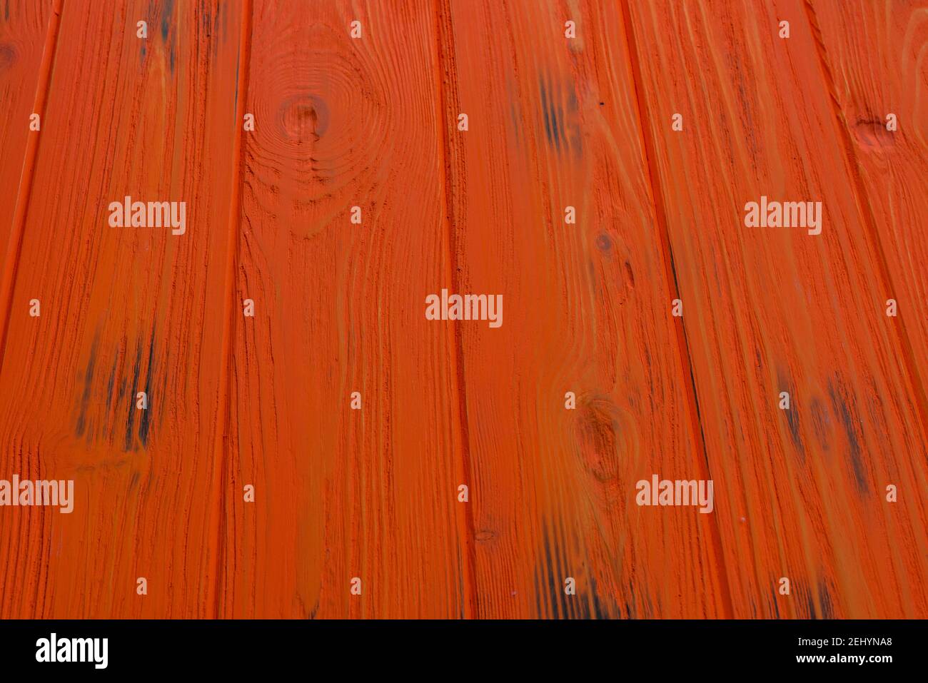 orange plank wood texture background. Close up of painted wooden fence ...