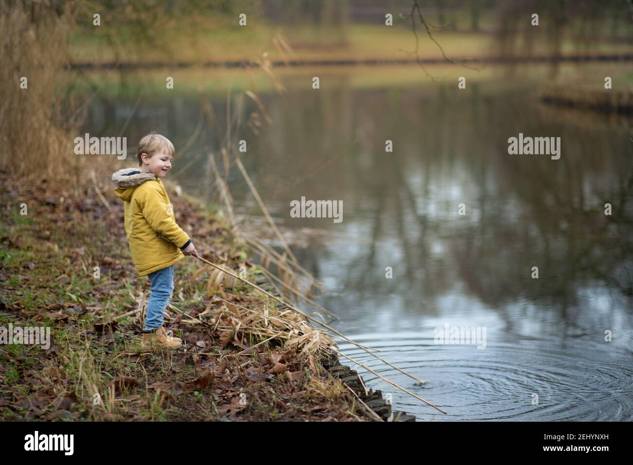 Kid child fishing with stick hi-res stock photography and images - Alamy