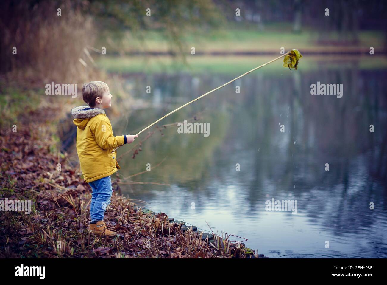 Kid child fishing with stick hi-res stock photography and images - Alamy