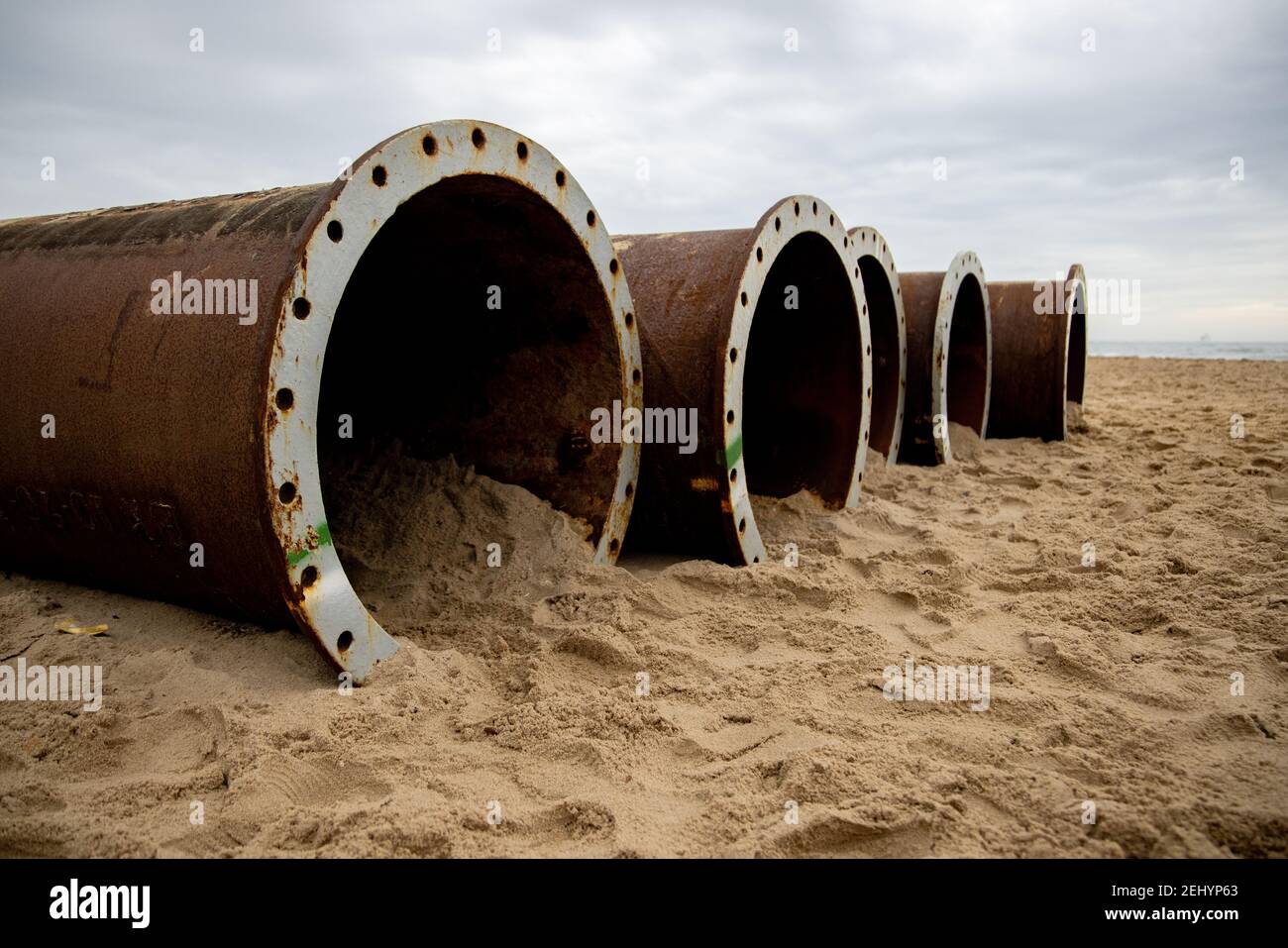 Large bore steel pipes used for pumping dredged sand to build up the ...