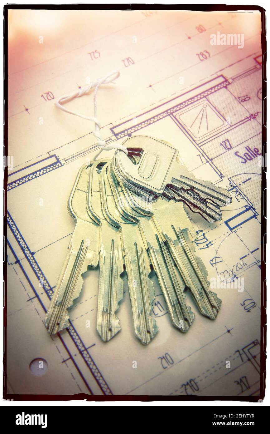 Keys resting on architectural blueprints at a construction site during ...
