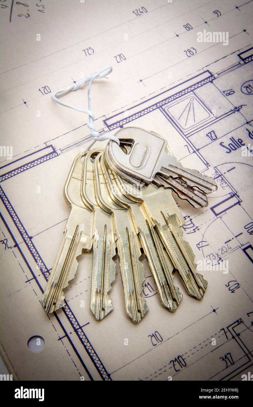 Keys resting on architectural blueprints at a construction site during ...