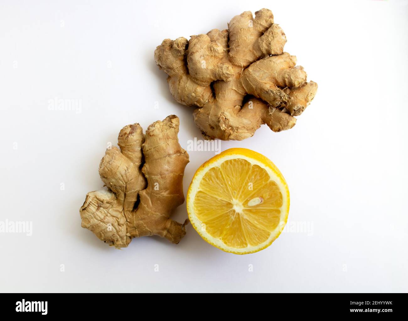 root ginger with lemon on a white background Stock Photo - Alamy