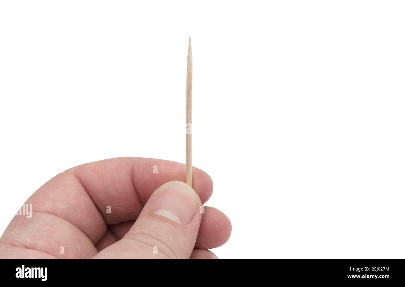 Hand holding toothpick isolated on white background Stock Photo - Alamy