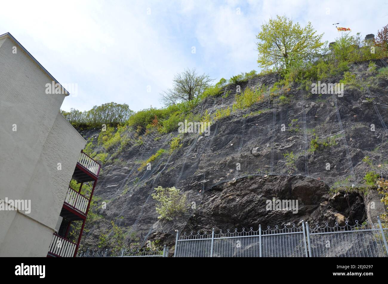 large rock wall with netting protection in Quebec, Canada Stock Photo ...