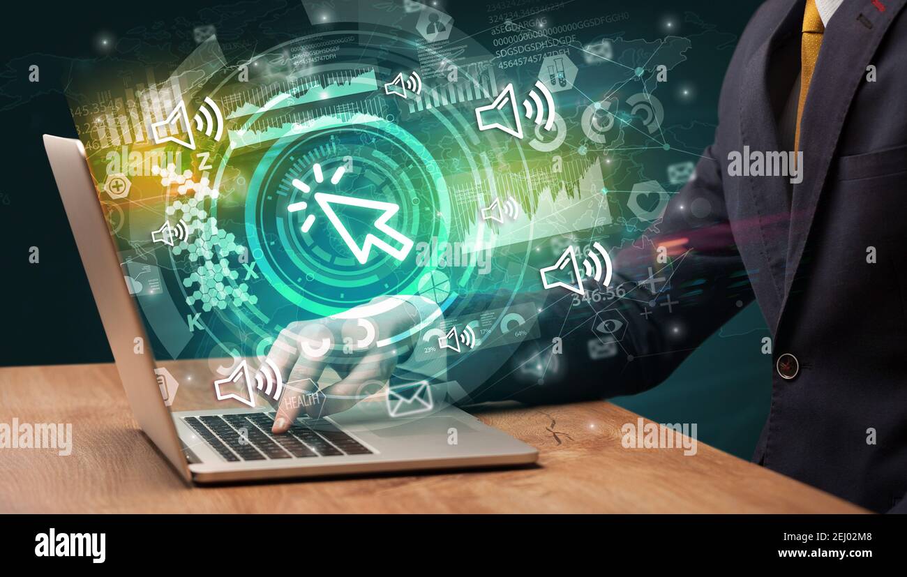 Business hand typing on a modern laptop with cursor icon coming out ...