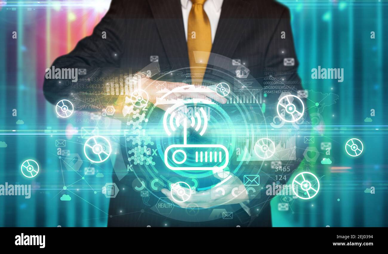 Businessman holding wireless technology icon in his hands with multiple ...