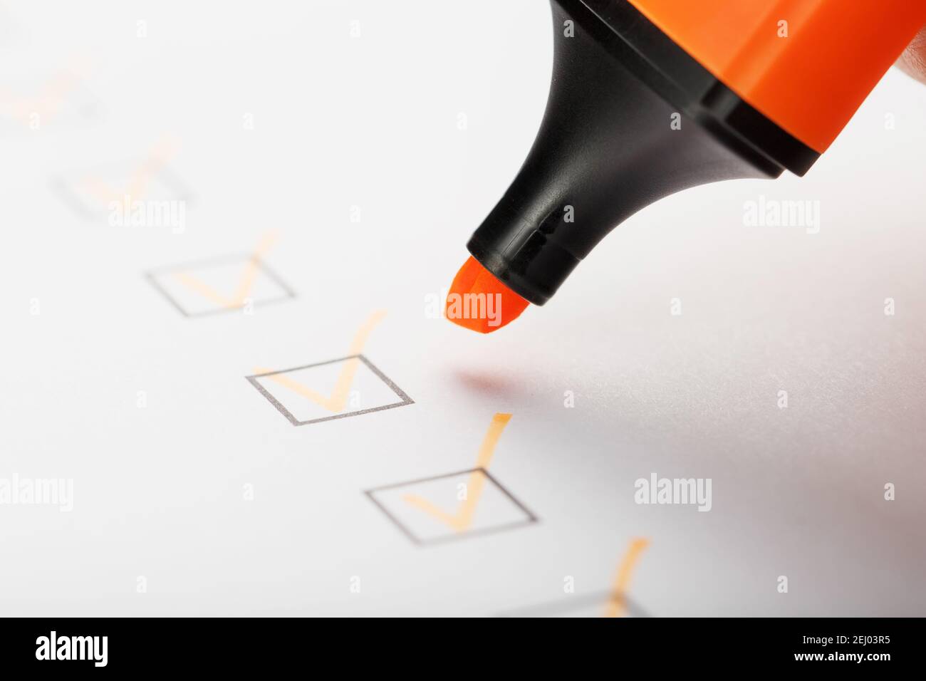 Orange marker with markers on the checklist sheet. Checklist completed ...