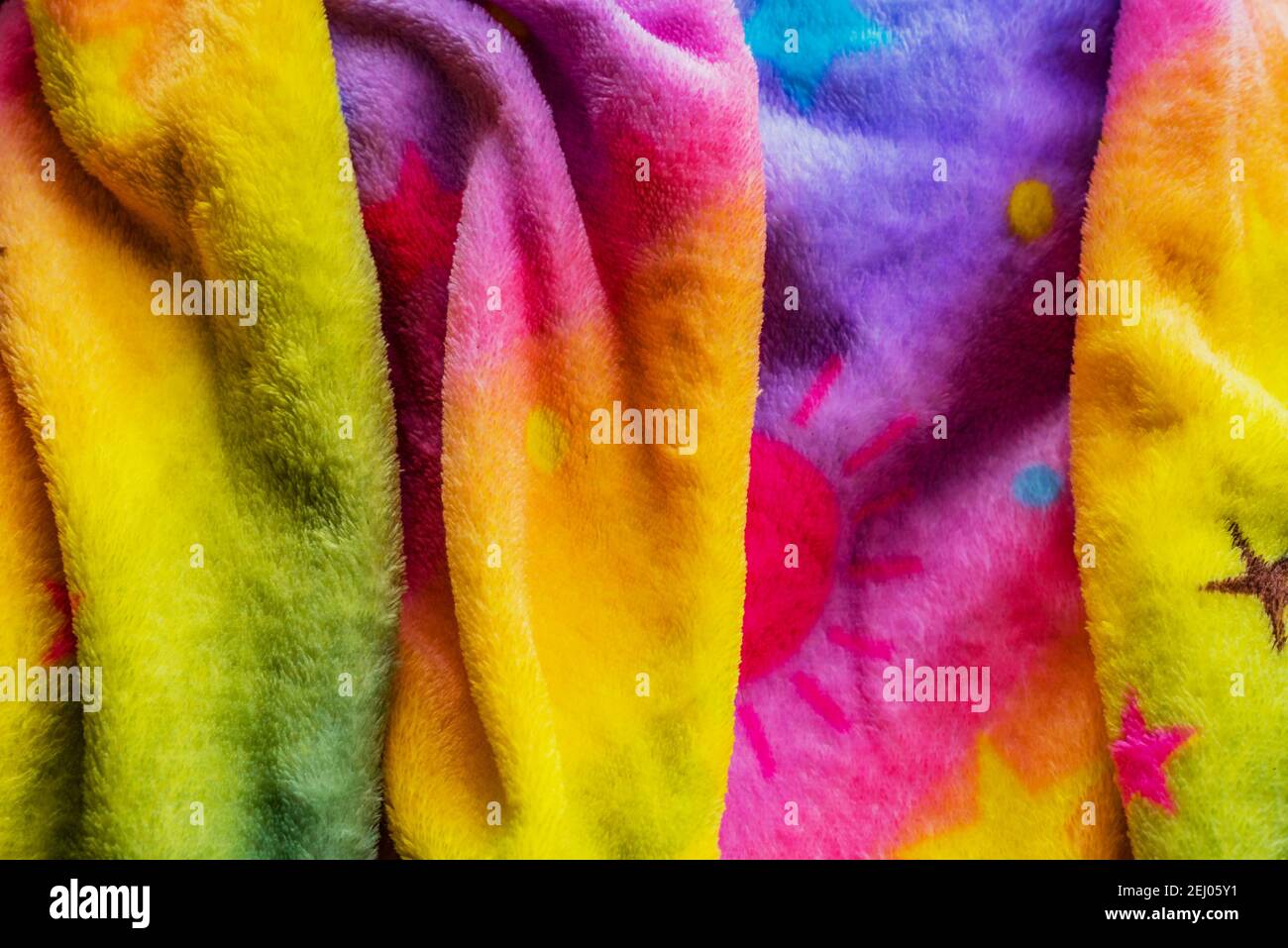 fleece fabric in folds texture. Bright colorful fleece. bright color ...