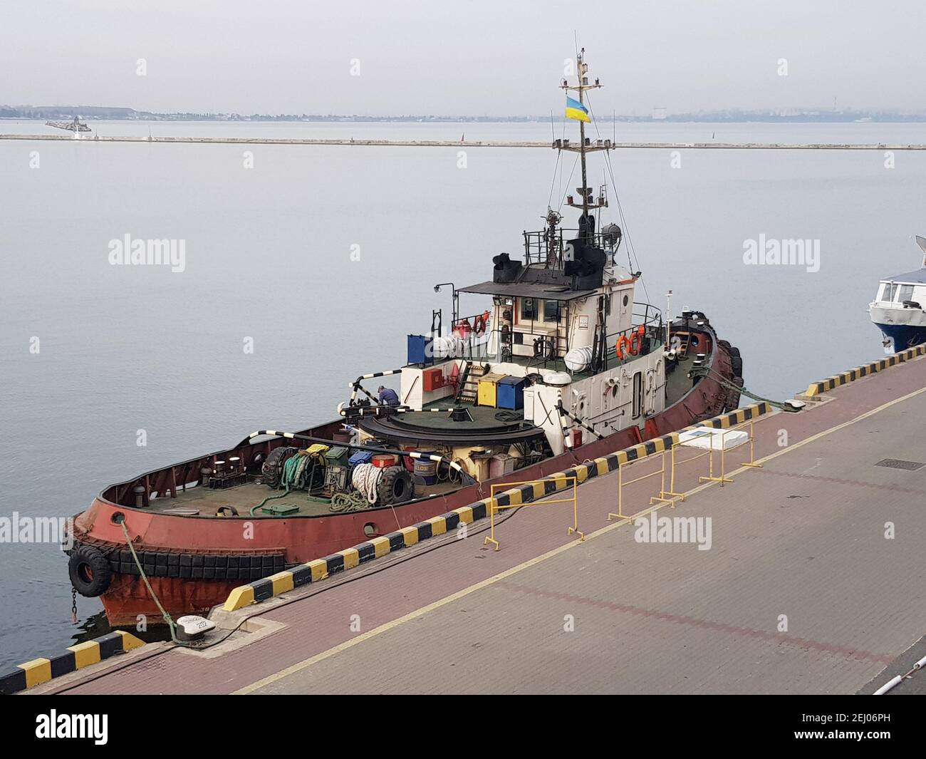 Towing ship moored in the port. Commercial port, Delivery Stock Photo ...