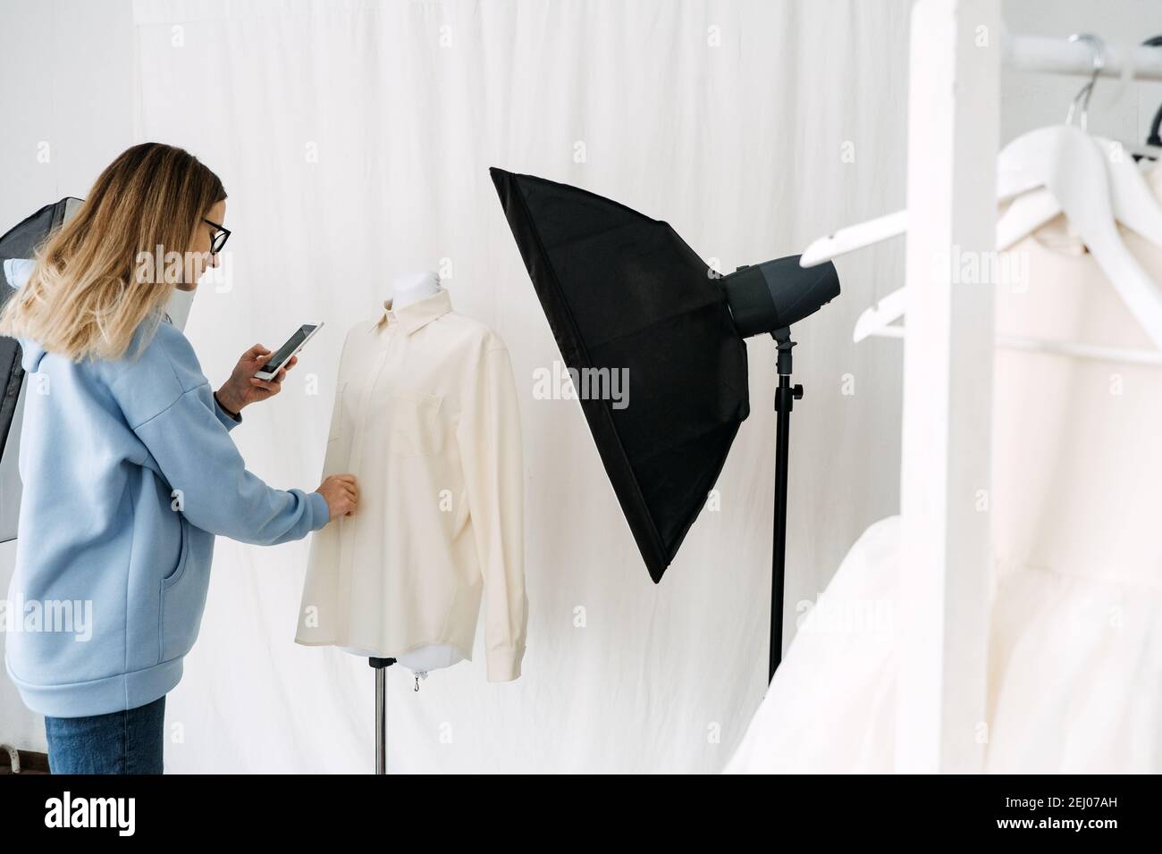 AR VR Technology in Fashion Industry. Female designer shotting clothes ...