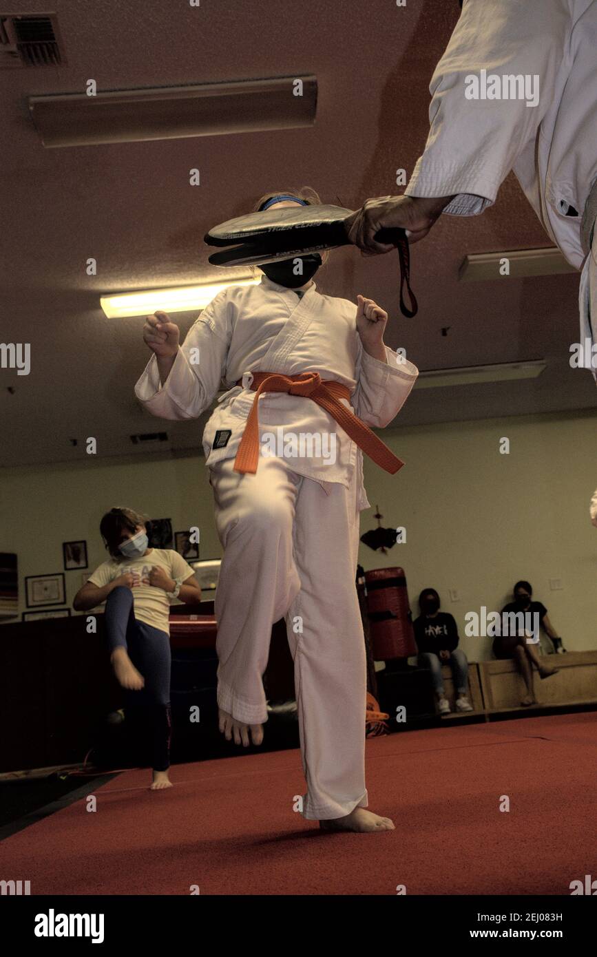 This action photo is of my daughter in her Karate class. Karate is a ...
