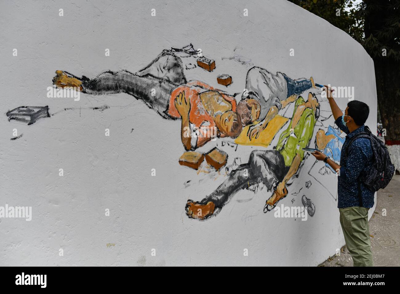 A Student of Fine Art at the University of Dhaka draws Alpana on the ...