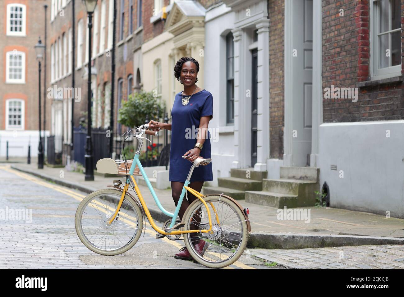 Girl standing with bicycle background urban in London , UK Stock Photo ...