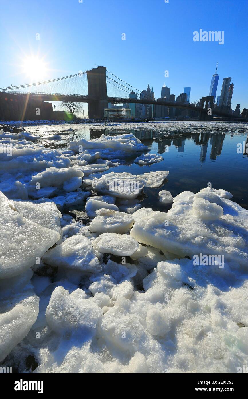 Frozen ice chunks float and drift in the East River due to the cold ...