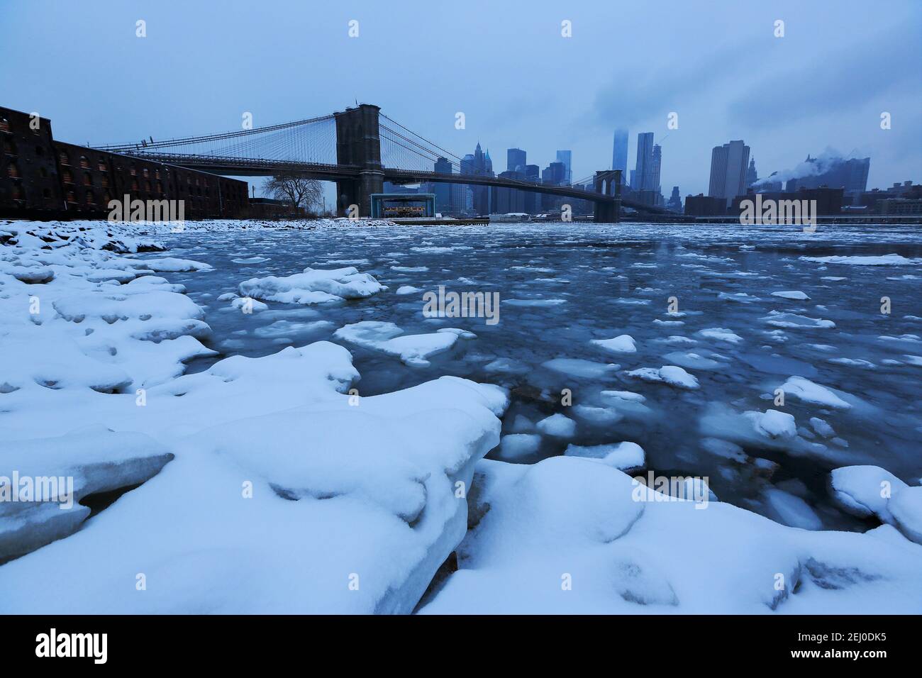 Frozen ice chunks float and drift in the East River due to the cold ...