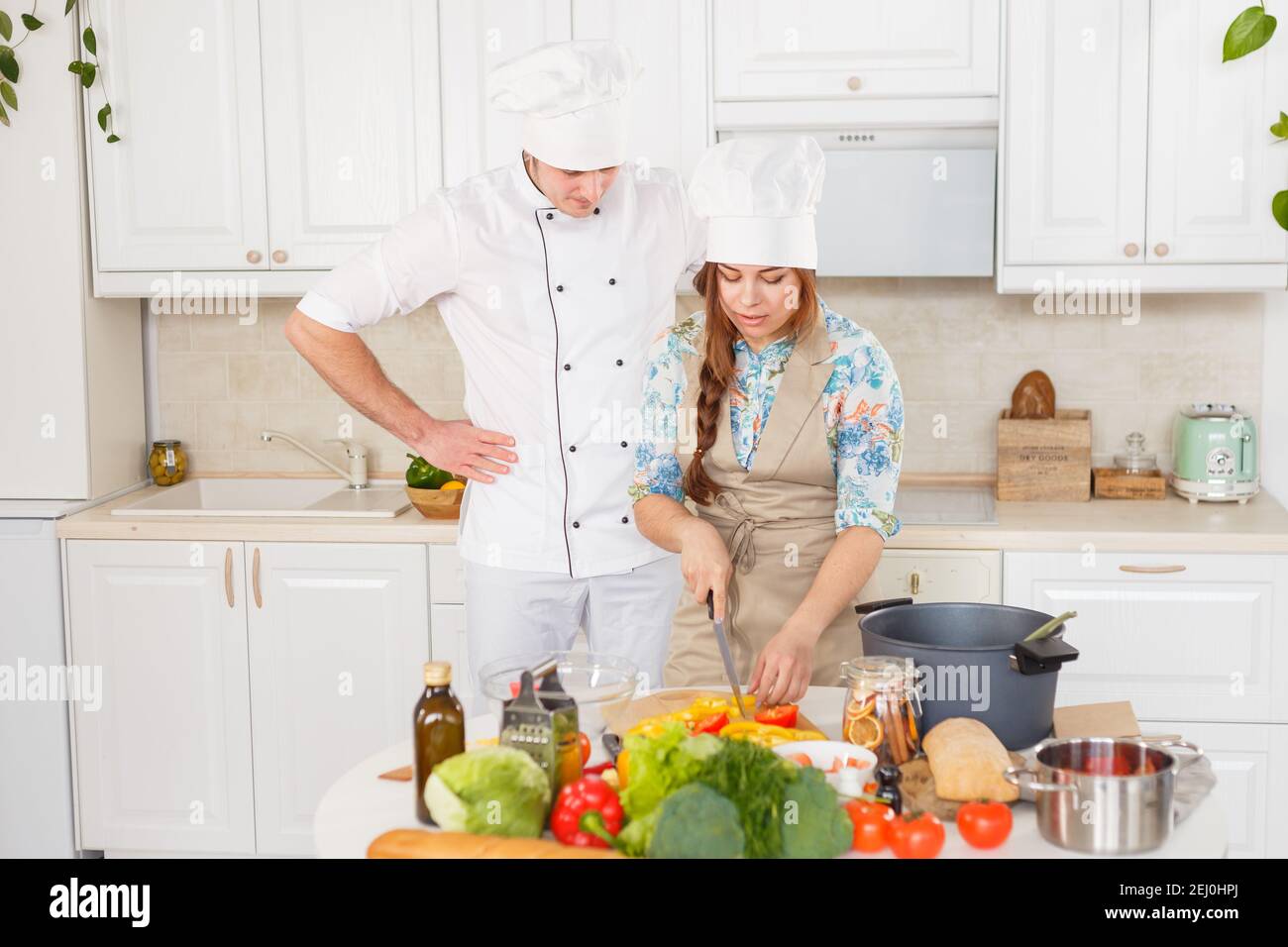 A senior chef giving cooking lesson to young chefs Stock Photo - Alamy