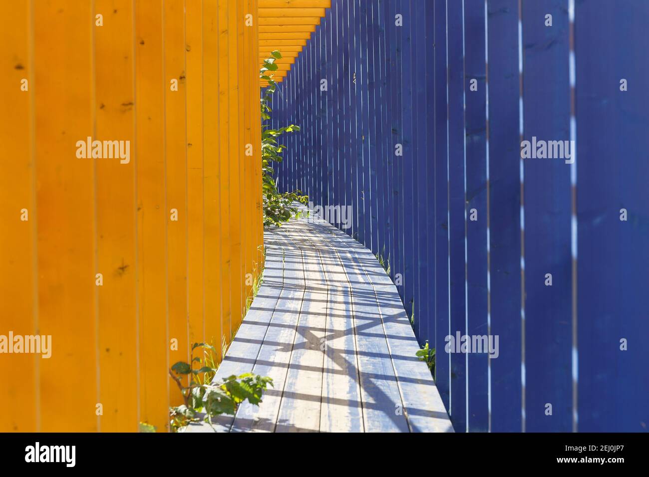 Colorful wooden passage, city decoraction. Painted in bright blue and ...