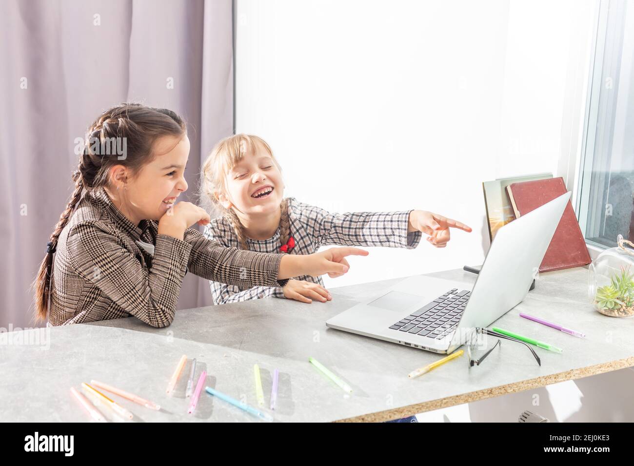 two little girls studying online. Distance Learning Online, e-learning ...