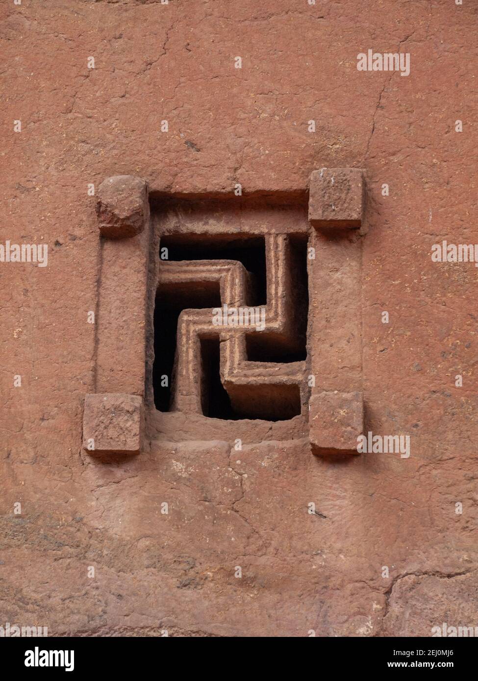 Lalibela rock hewn church window with swastika Stock Photo - Alamy