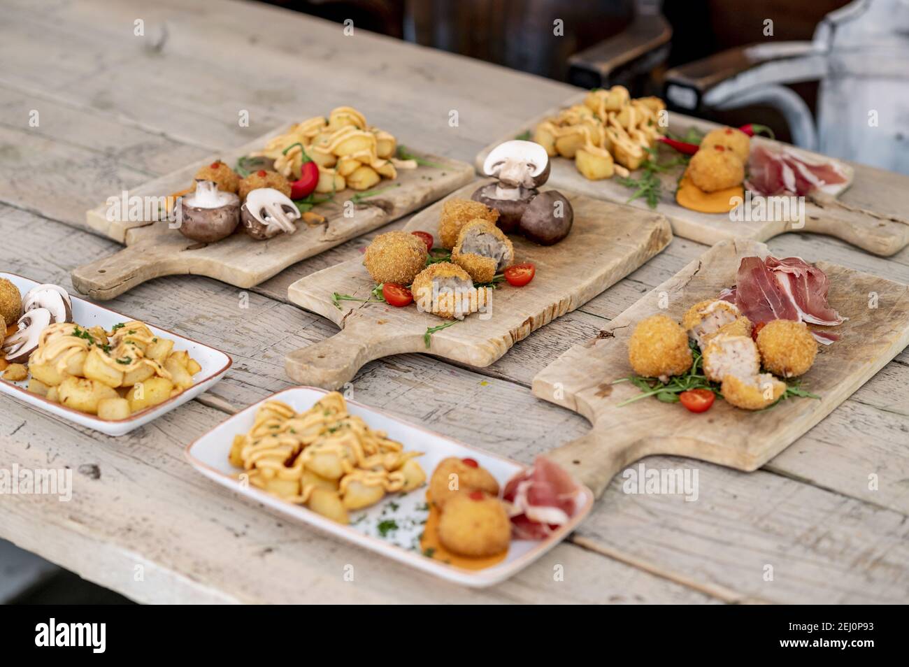 Delicious food served on wooden boards in a restaurant Stock Photo - Alamy