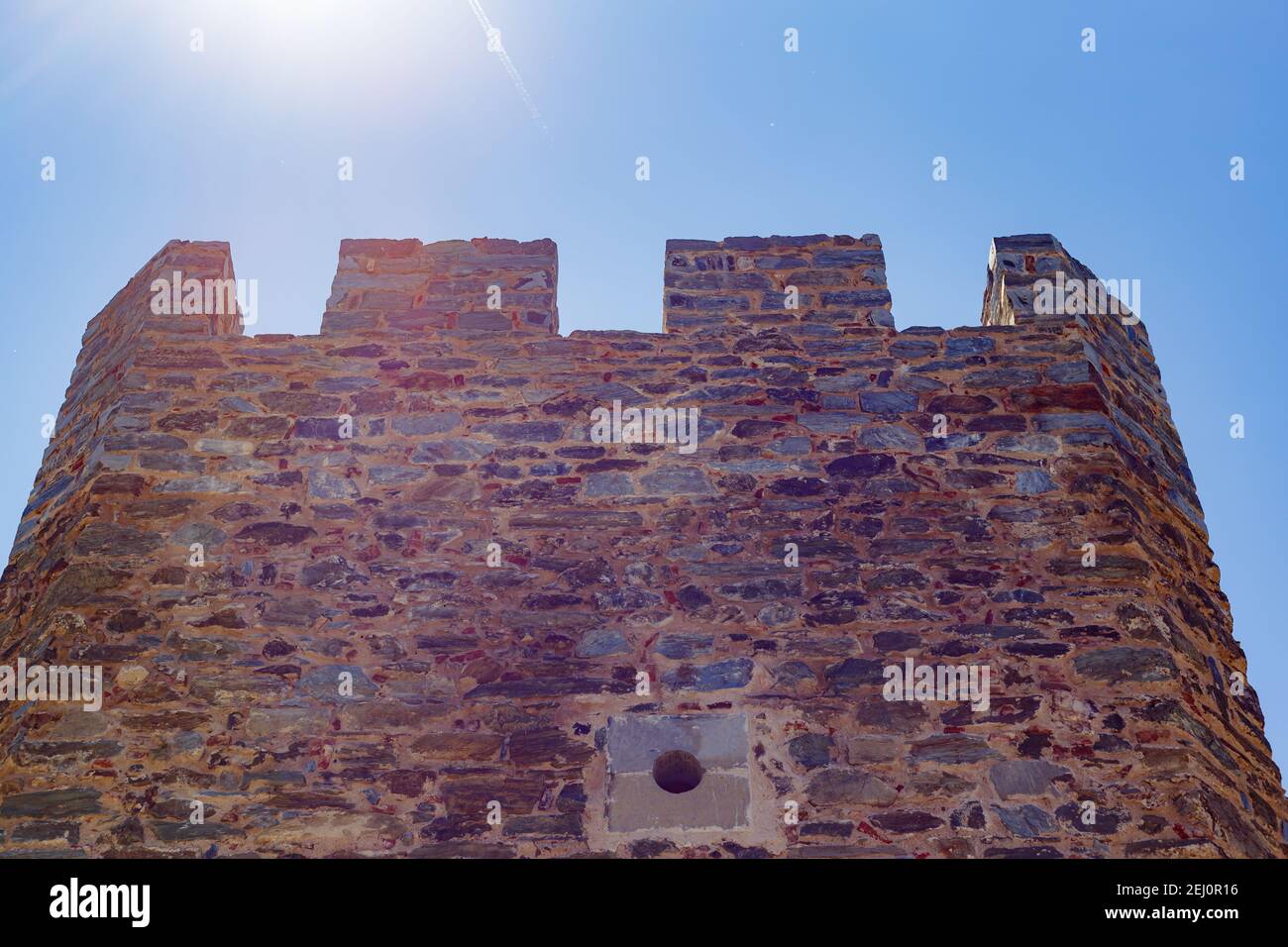 Low angle shot of a historic medieval stone castle on background of the ...