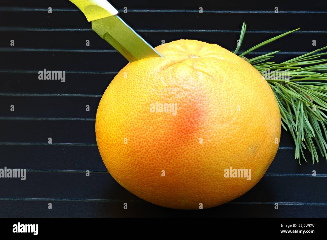 Ripe juicy grapefruit in isolation on a black background. A large image ...