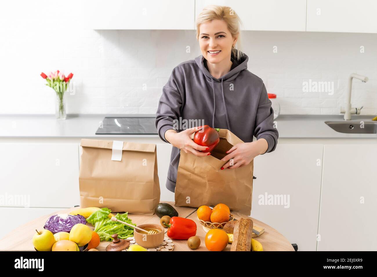 Healthy food. Woman preparing fruits and vegetables Stock Photo - Alamy