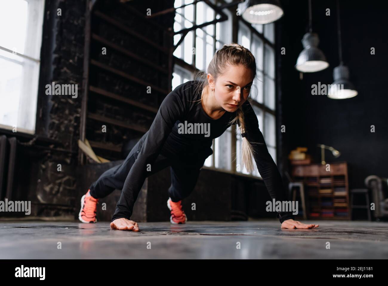 Young girl doing sports in the gym. Atmospheric gym Stock Photo - Alamy